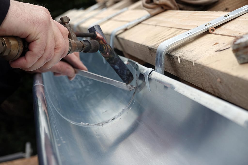 How To Repair Gutter Seams (Prevent Leaks, Clogs, & More)