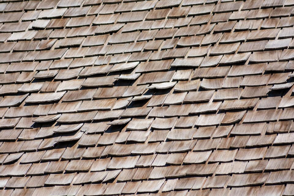 7 Signs & Symptoms Of Buckling Shingles On Your Roof